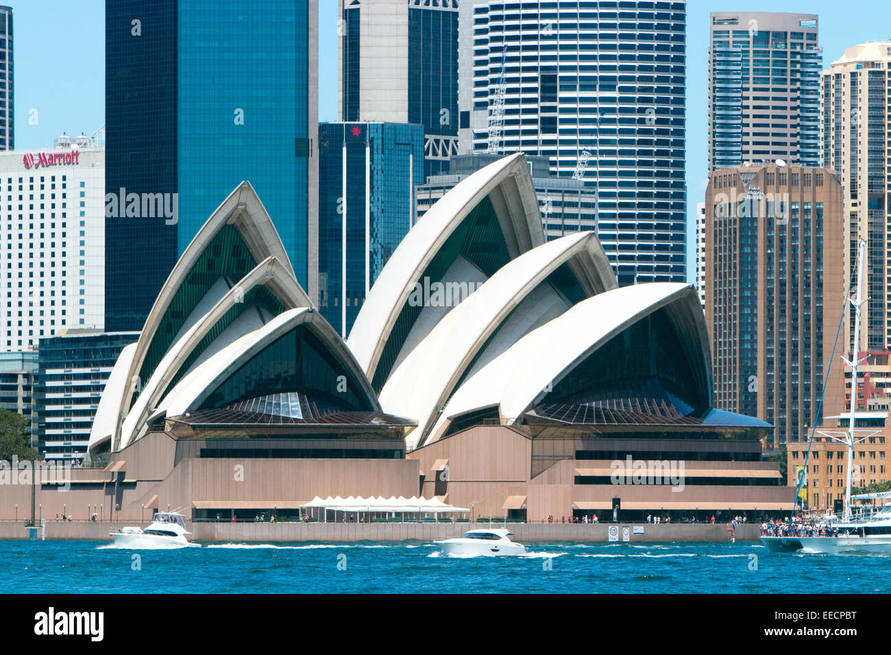Sydney opera house viewed from the harbour, with office skyscrapers ...