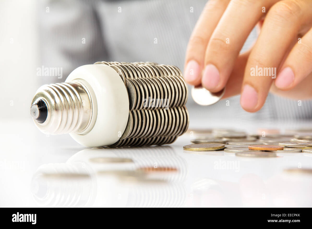 abstract image of coin light bulb,save energy concept Stock Photo - Alamy