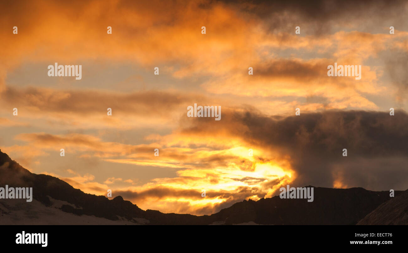 wee red clouds on the sky. clouds in the light of the setting sun ...