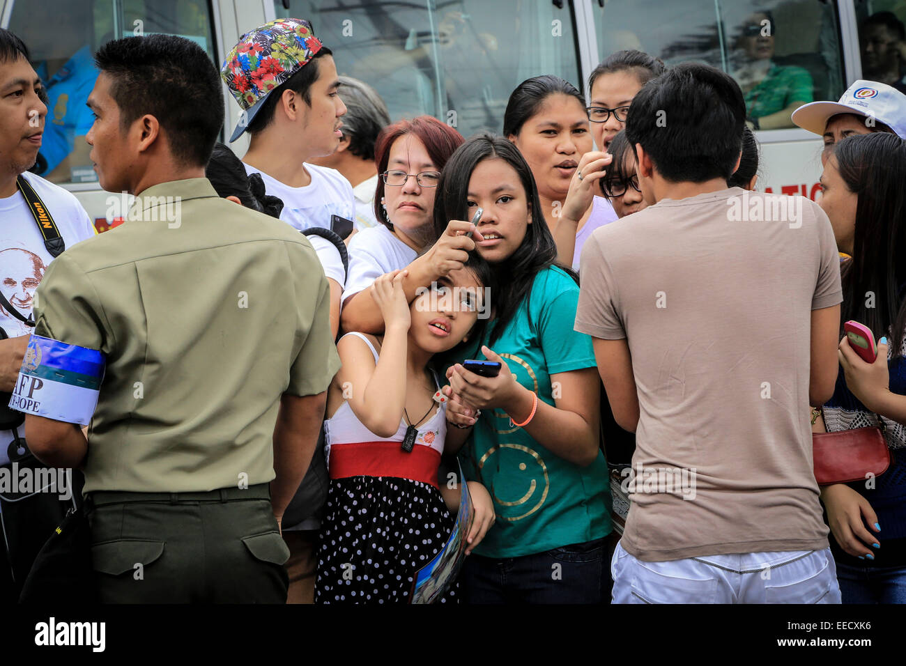 Manila, Philippines. 16th Jan, 2015. People wait on the road to see the ...