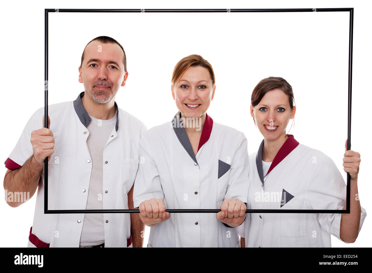 nurses are looking through a frame isolated on white Stock Photo - Alamy