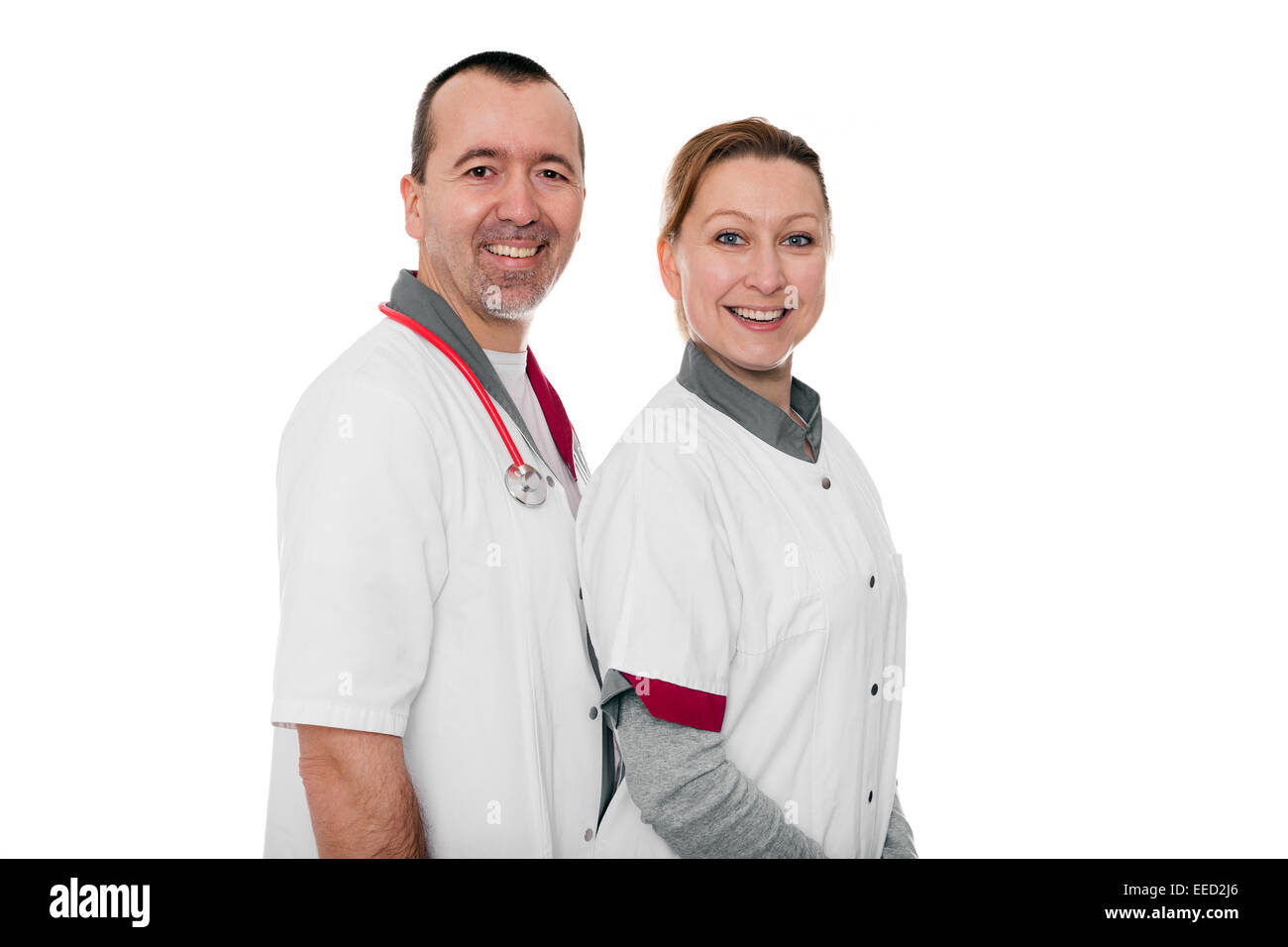 two nurses smiling to the viewer, isolated on white Stock Photo - Alamy
