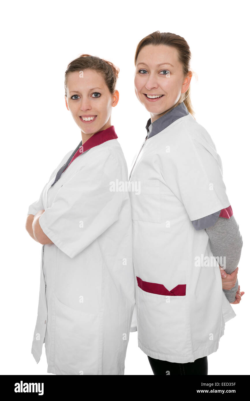two nurses smiling to the viewer, isolated on white Stock Photo - Alamy