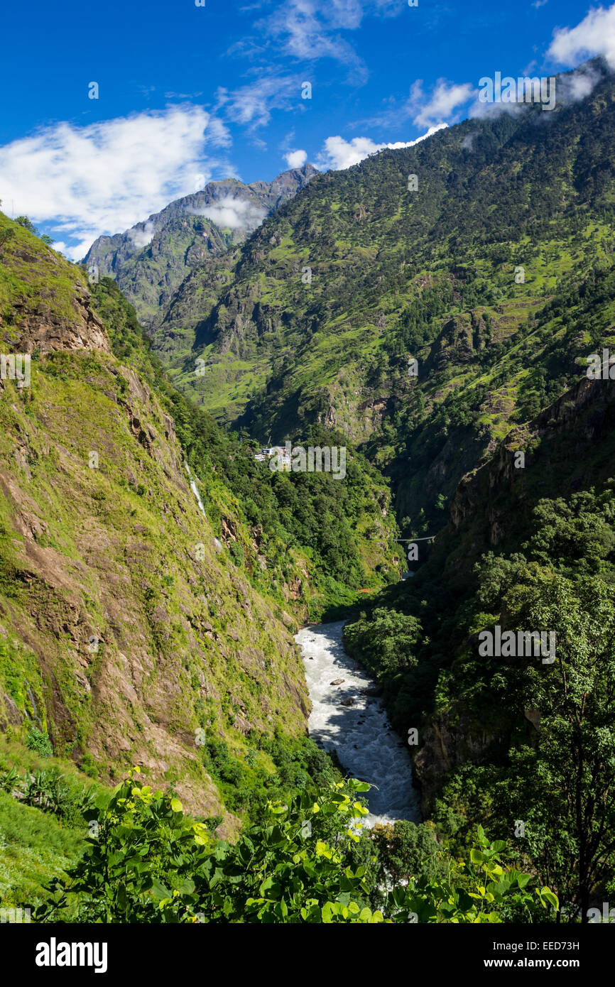 The Marshyangdi River flows through the bottom of a valley in the ...