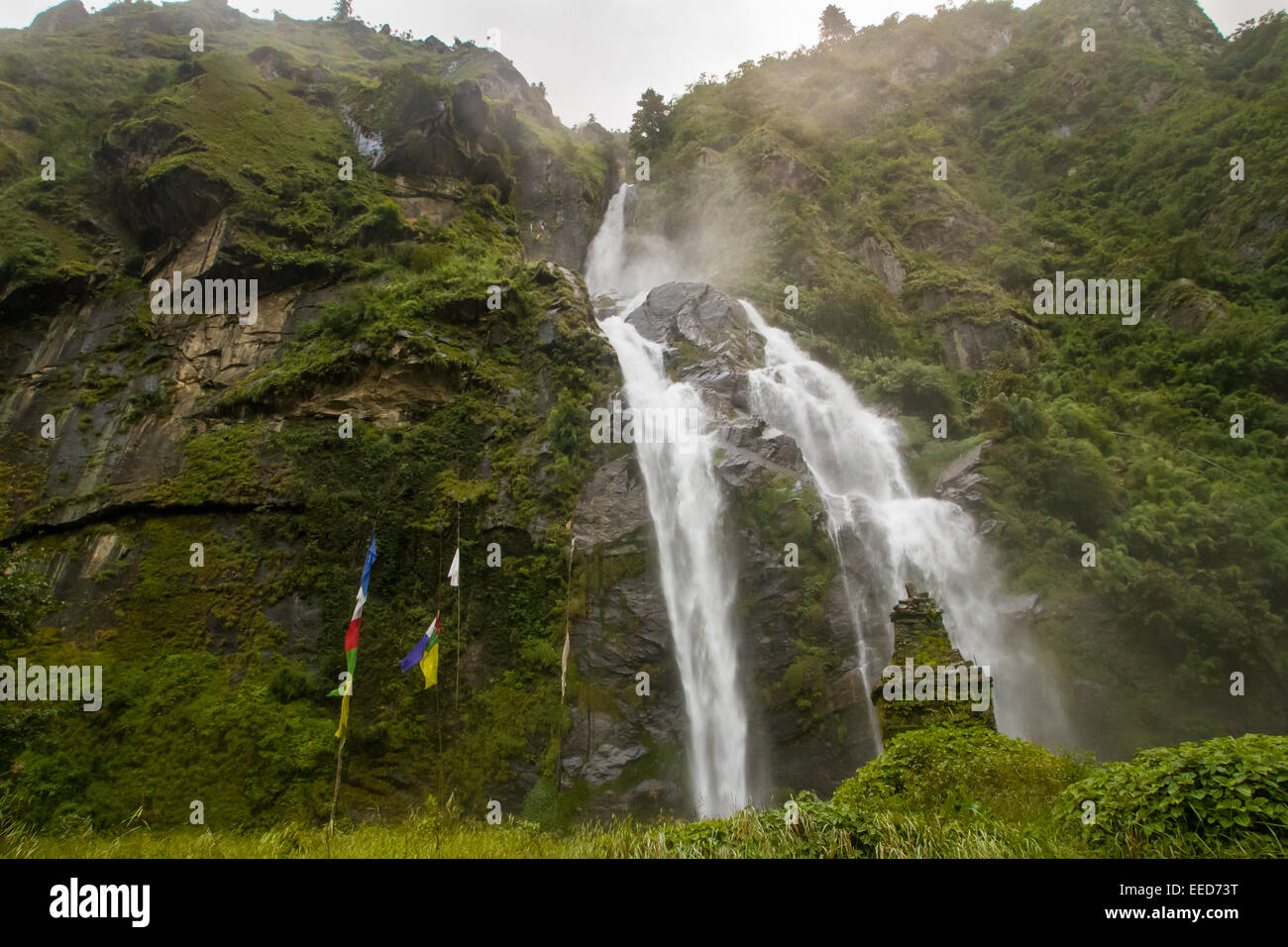 A waterfall and Buddhist shrine (stupa) just outside the village of Tal ...
