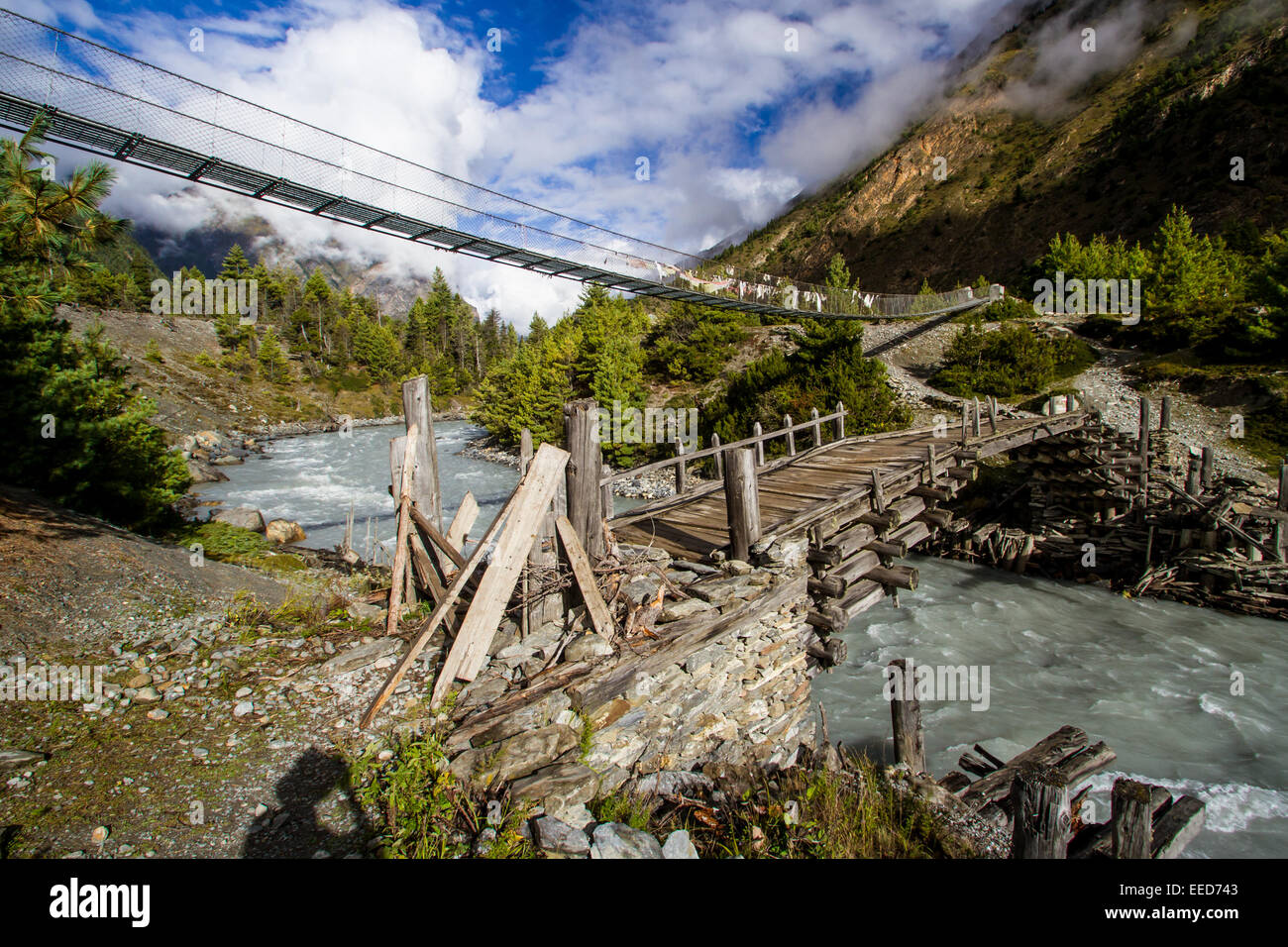 Bridges over a river in the Himalayas of Nepal, seen while trekking ...