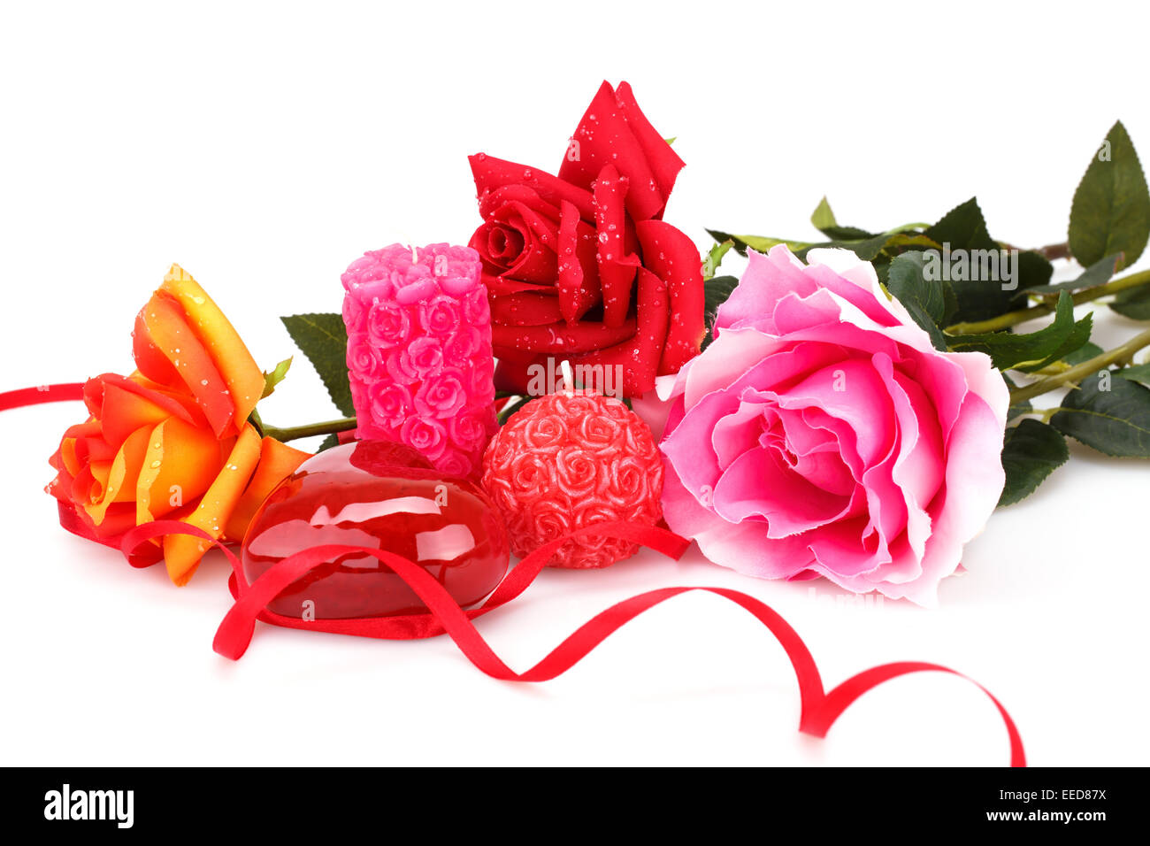Candles and roses isolated on white background Stock Photo - Alamy