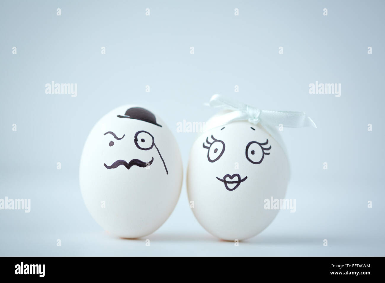 Two Easter eggs stylized as lady and gentleman Stock Photo - Alamy