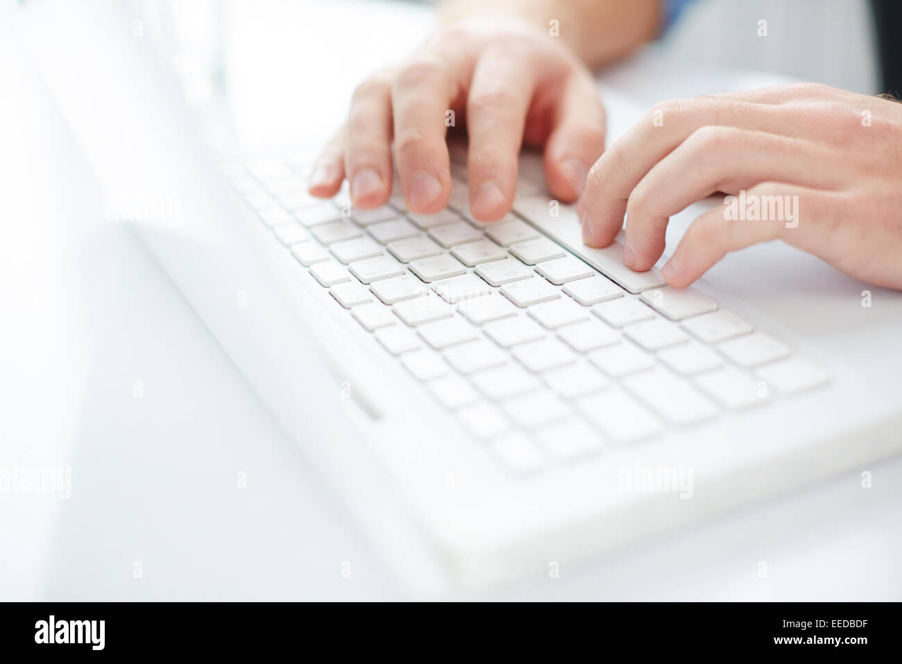 Fingers of man pressing laptop keys Stock Photo - Alamy