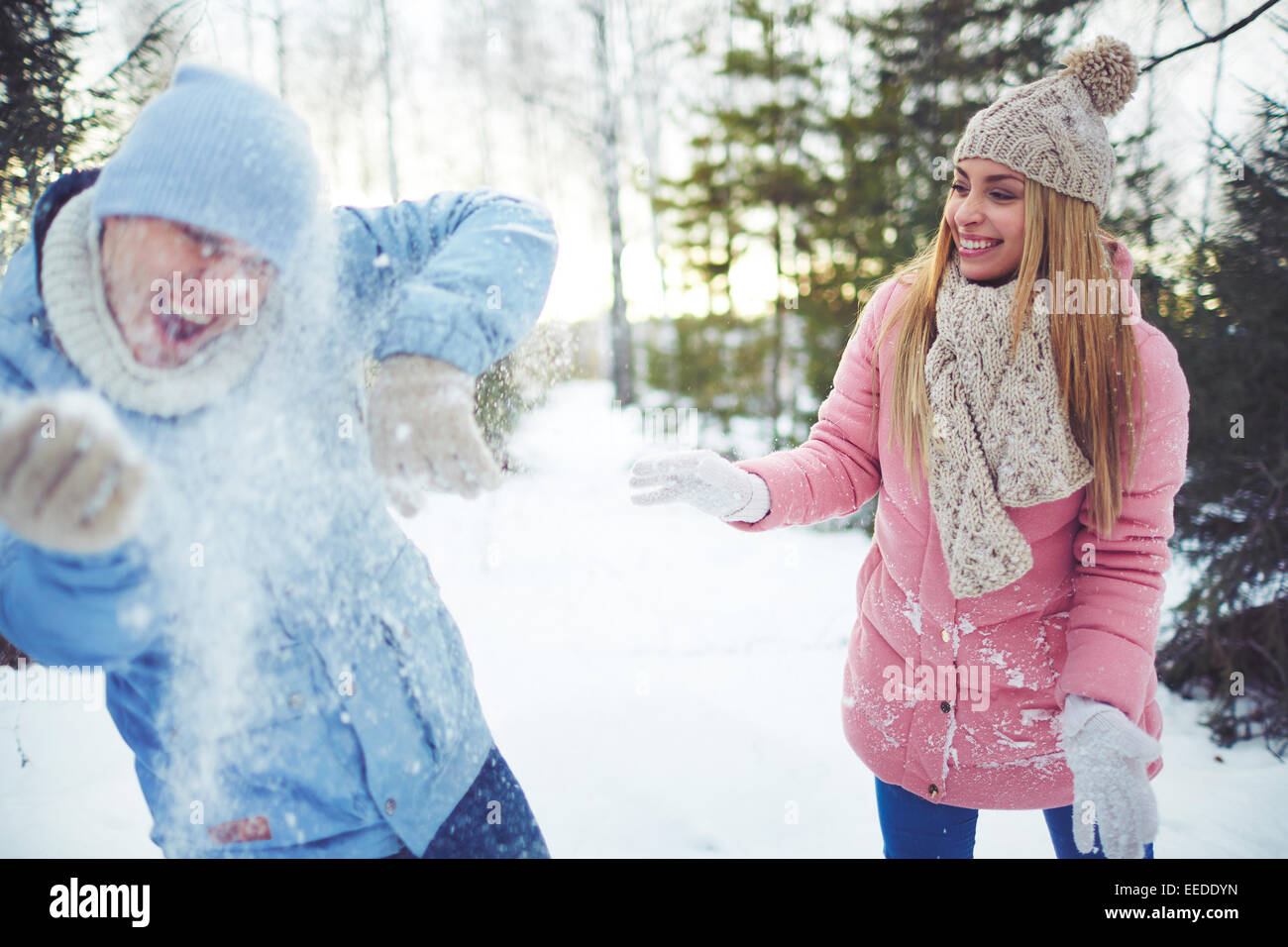 Man woman playing snowballs in hi-res stock photography and images - Alamy