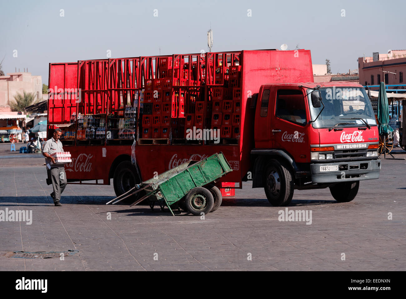 Man unloading Coca Cola from a delivery lorry in the Jemaa el Fna ...