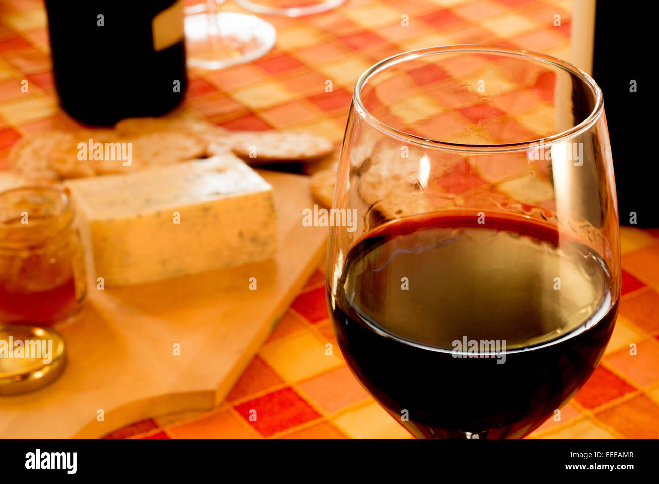 Glass of red wine, cheese, bread, in the rustic table Stock Photo - Alamy