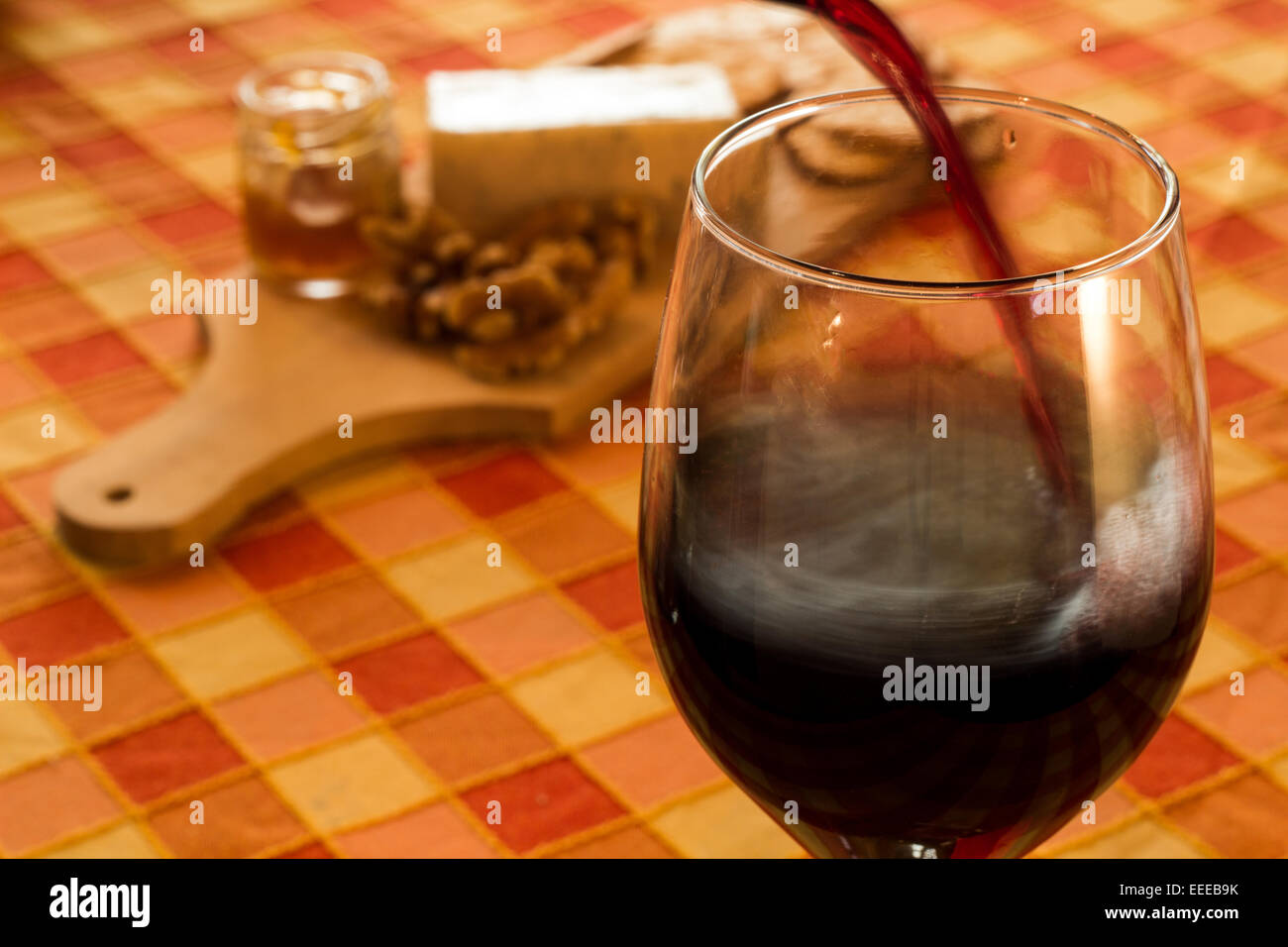 Red wine in the rustic table Stock Photo - Alamy