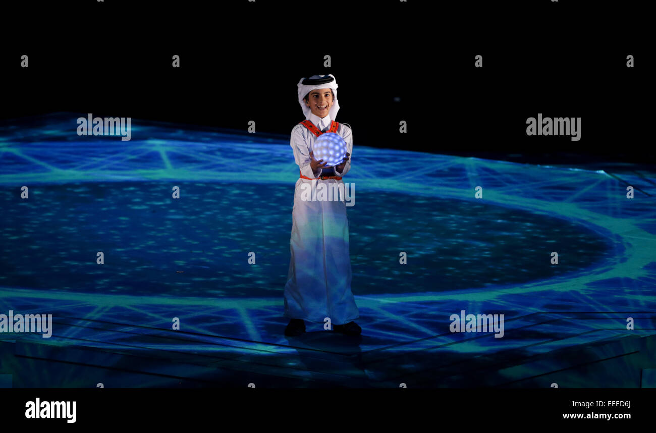 A boy with an illuminated handball stands in the center of the Lusail ...