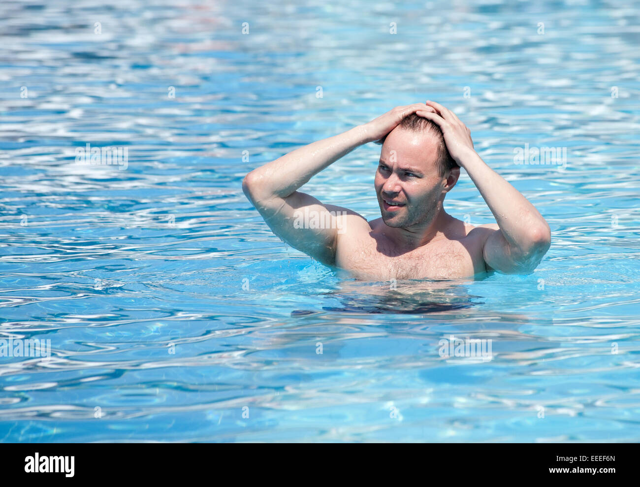 Man swimming in pool Stock Photo - Alamy