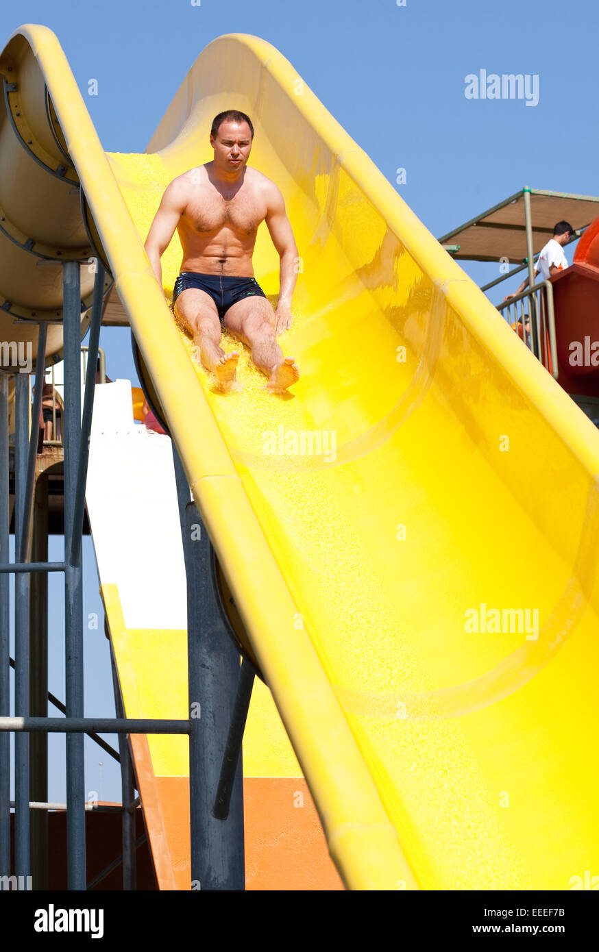 Man riding a water slide Stock Photo - Alamy