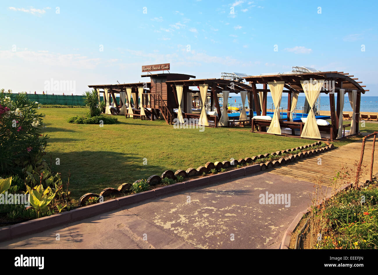 Pavilions Planet Beach Club on the beach Stock Photo - Alamy