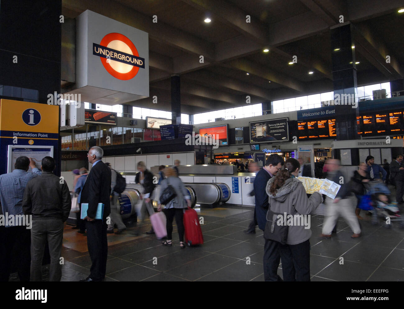 Underground sign and escalator entrance to Euston Underground station ...