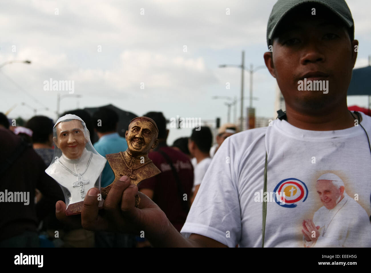 A vendor selling small Pope Francis busts for about three US Dollars ...