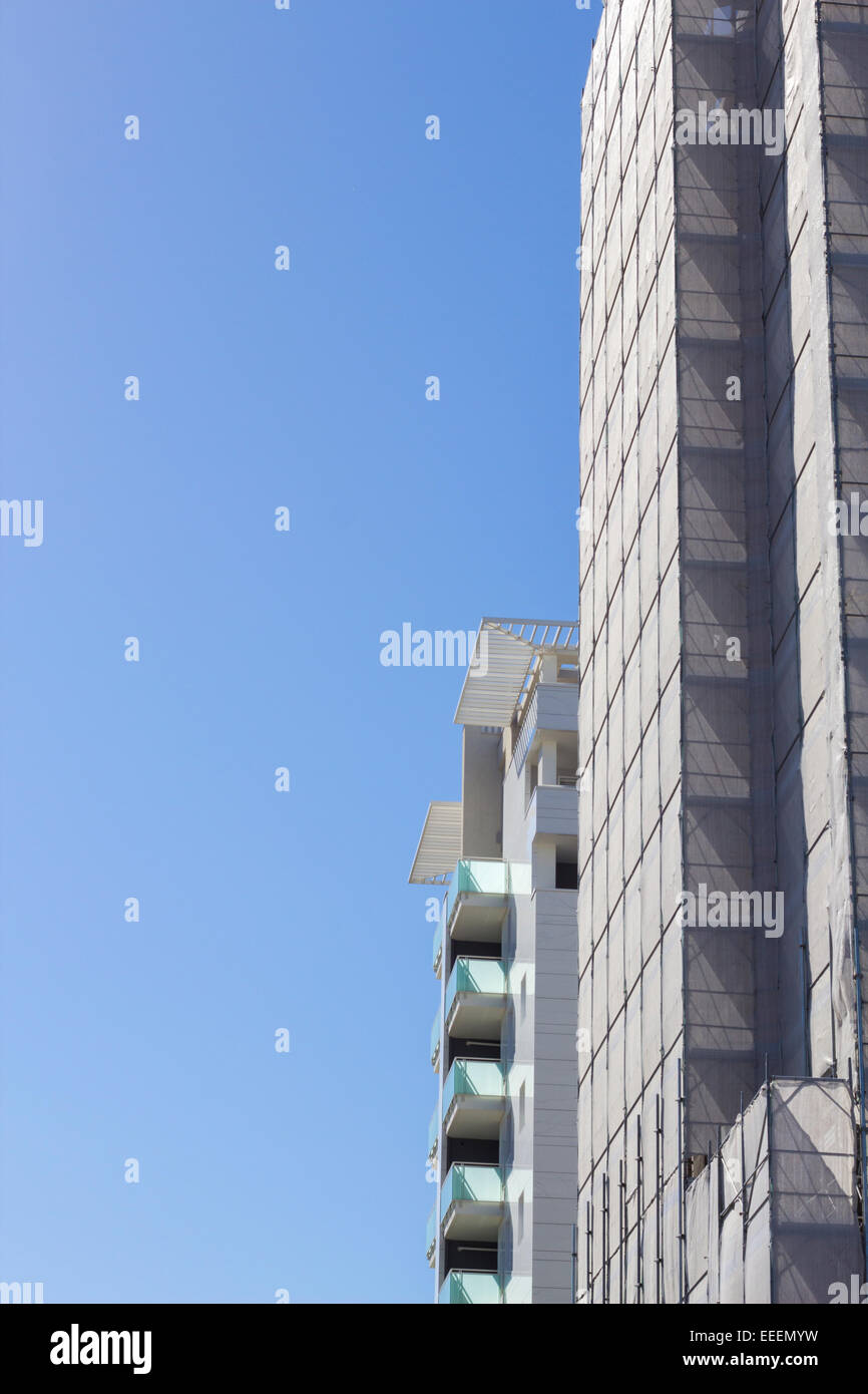 Vertical image of two buildings under construction Stock Photo - Alamy