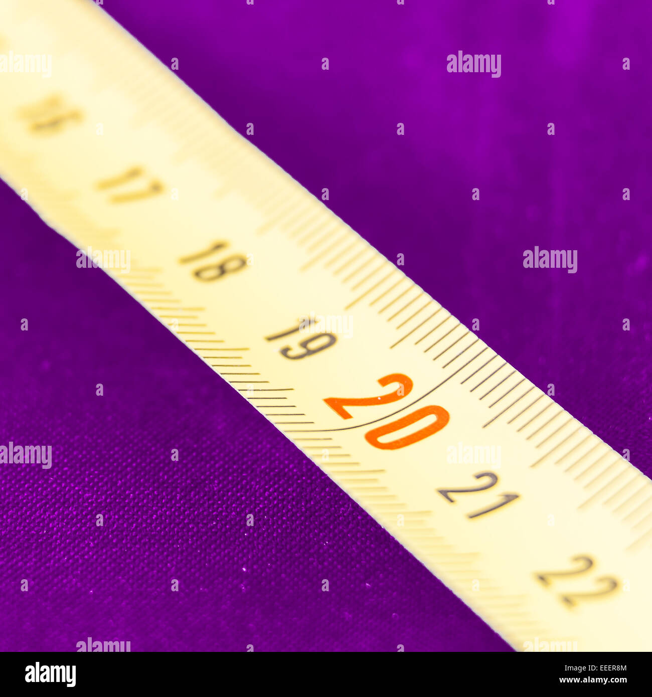 Twenty red centimeter. Particular of a rolled meter Stock Photo - Alamy