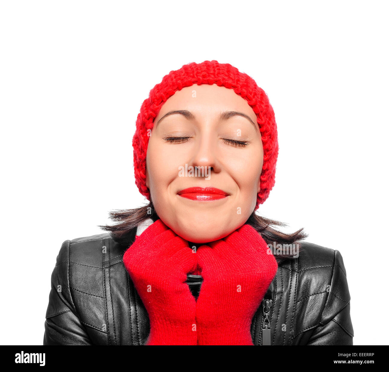 Beautiful woman in red hat, scarf and mittens over white background ...