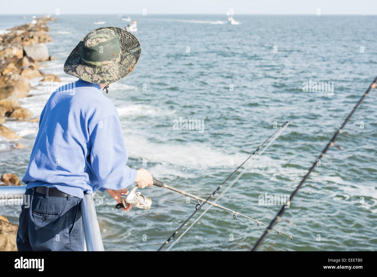 Man watching fishing boats hi-res stock photography and images - Alamy