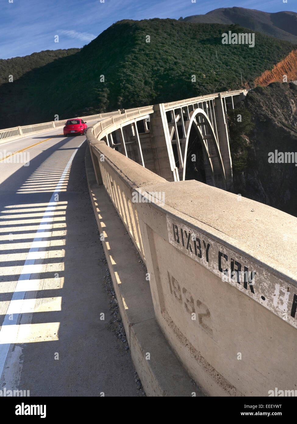 Bixby Bridge with lone red car crossing at Big Sur, Monterey ...