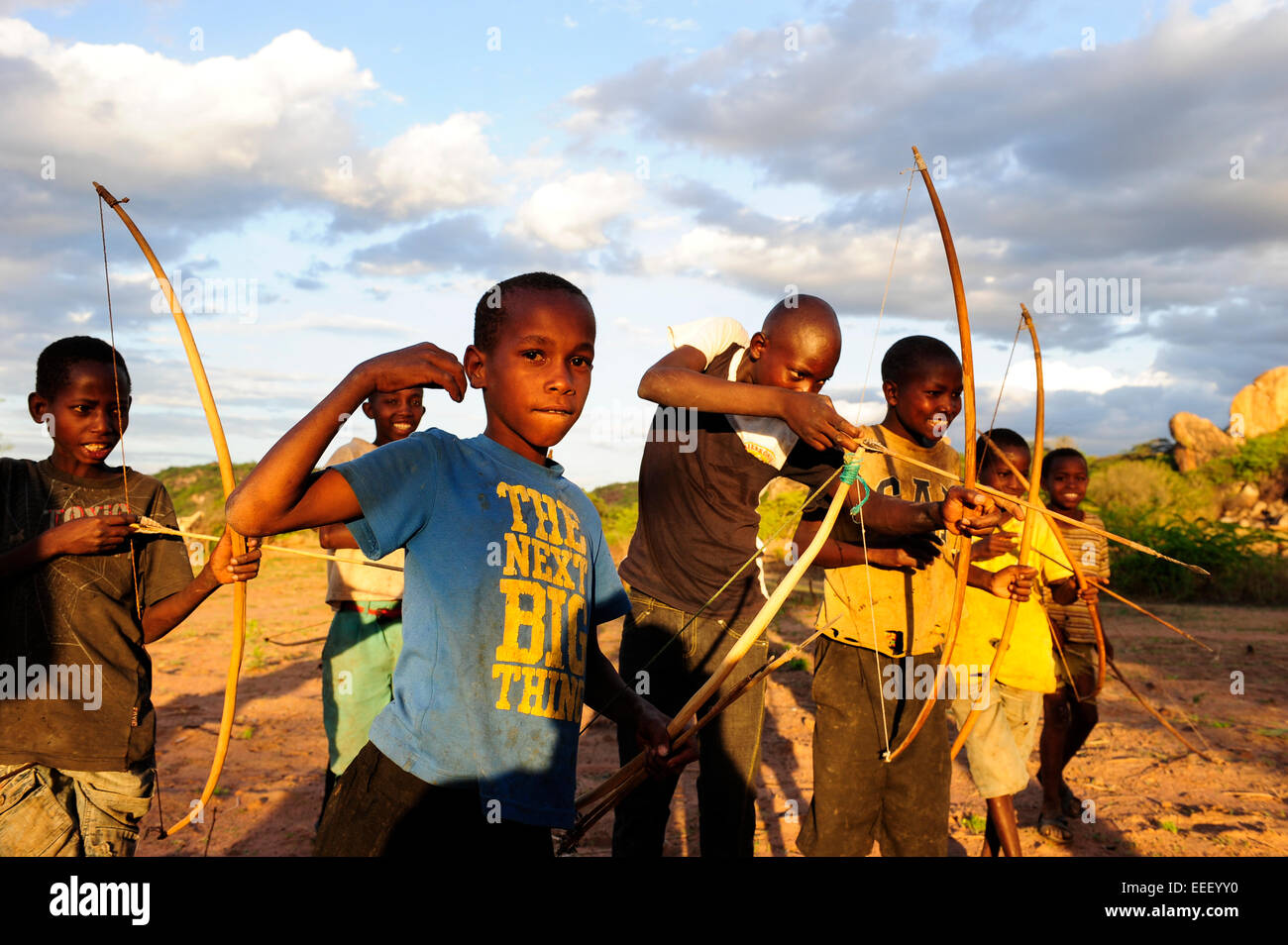 TANZANIA, Kondoa, children of Sandawe a hunter tribe play with bow and ...