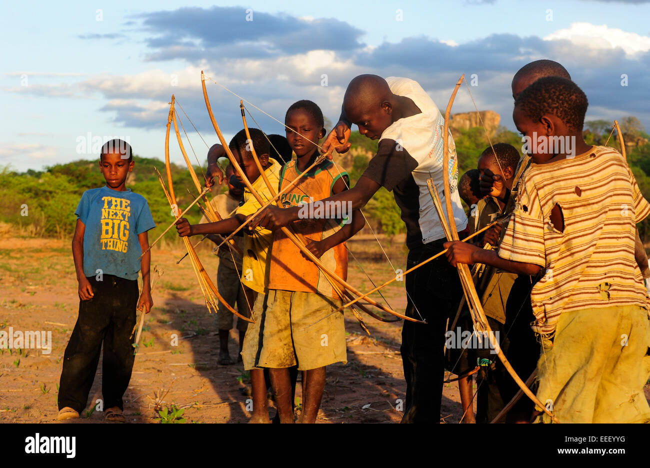 TANZANIA, Kondoa, children of Sandawe a hunter tribe play with bow and ...
