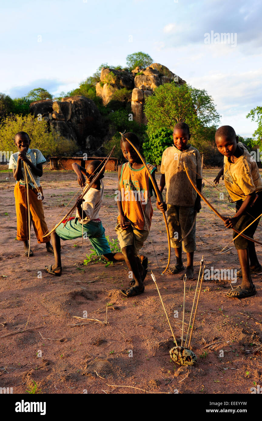 TANZANIA, Kondoa, children of Sandawe a hunter tribe play with bow and ...