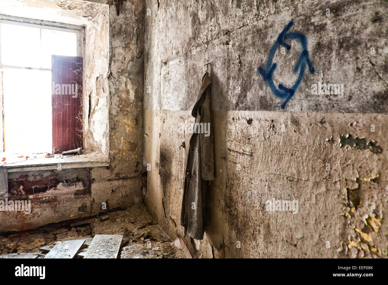 old coat in an abandoned house, sad to see dying old house Stock Photo ...