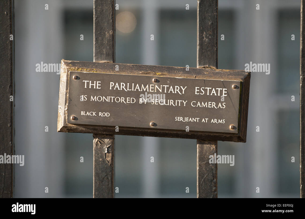 A sign reads 'THE PARLIAMENTARY ESTATE IS MONITORED BY SECURITY CAMERAS ...