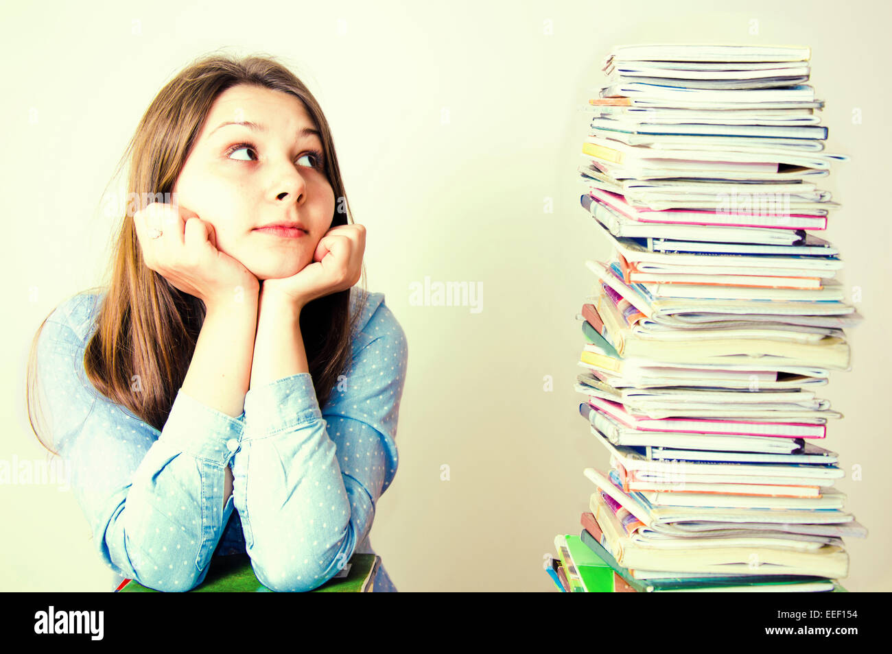 Young student have a lot of work to do. Education conceptual image ...