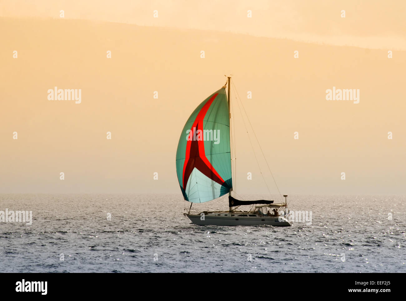 Sailboat at dawn near Lahaina, Maui in Hawaii Stock Photo - Alamy