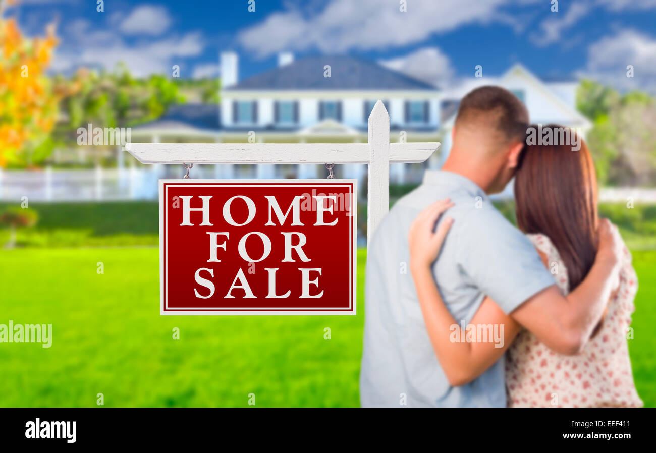 For Sale Real Estate Sign and Affectionate Military Couple Looking at ...