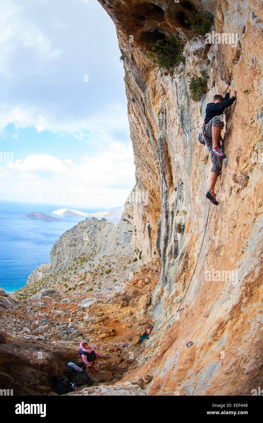 Young man lead climbing on cliff near sea, Kalymnos island, Greece ...
