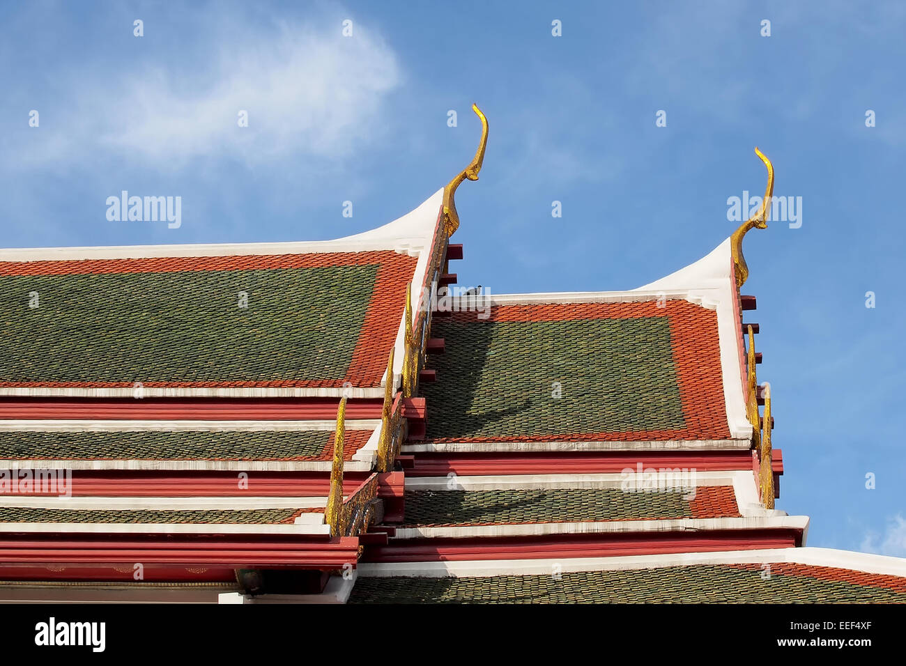 gable apex on temple roof with blue sky background Stock Photo - Alamy