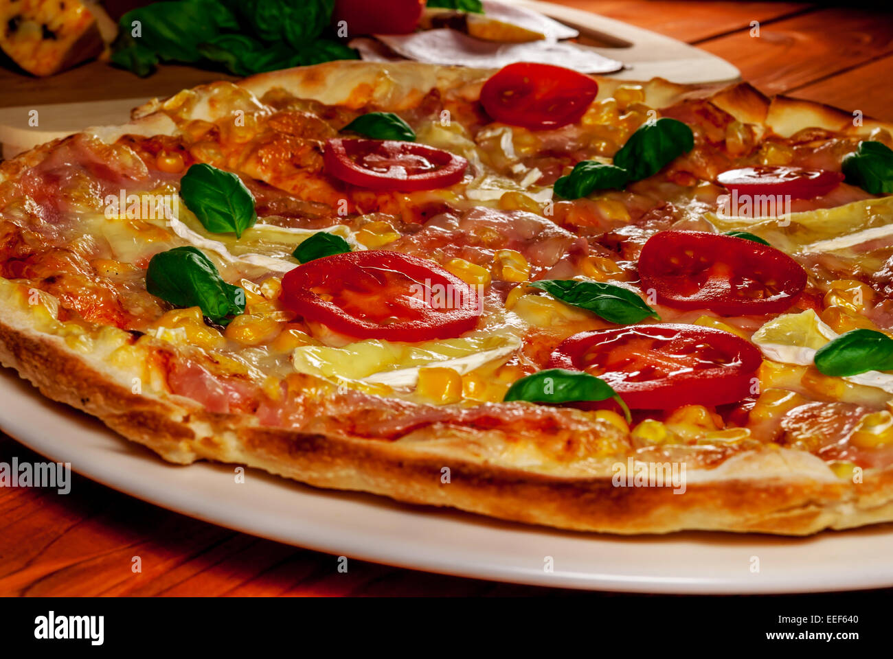 Italian traditional pizza with cheese and tomato Stock Photo - Alamy