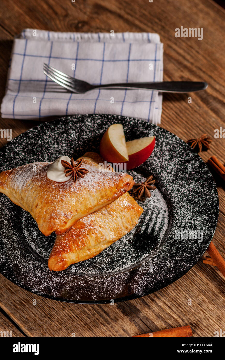 Apple dessert on black plate on wood table Stock Photo - Alamy