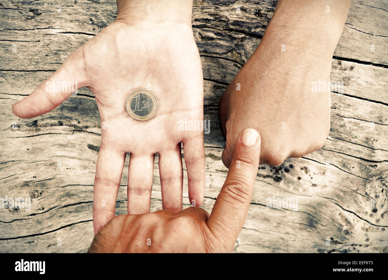 Guessing in which hand is the coin in brown color Stock Photo - Alamy