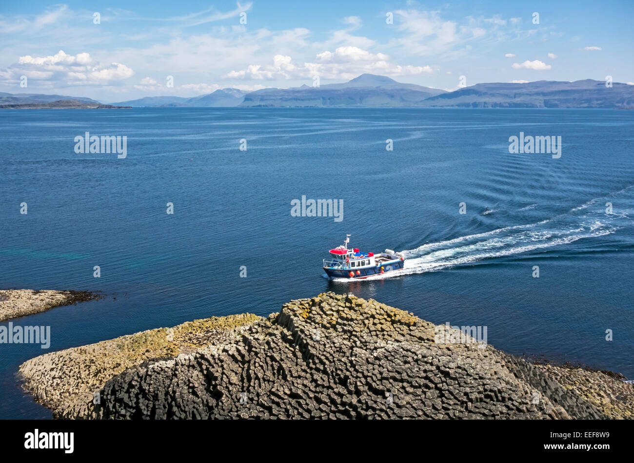 Passenger vessel Ullin of Staffa approaching the jetty on Staffa inner ...