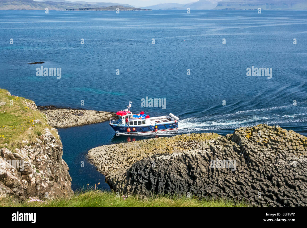 Passenger vessel Ullin of Staffa approaching the jetty on Staffa inner ...