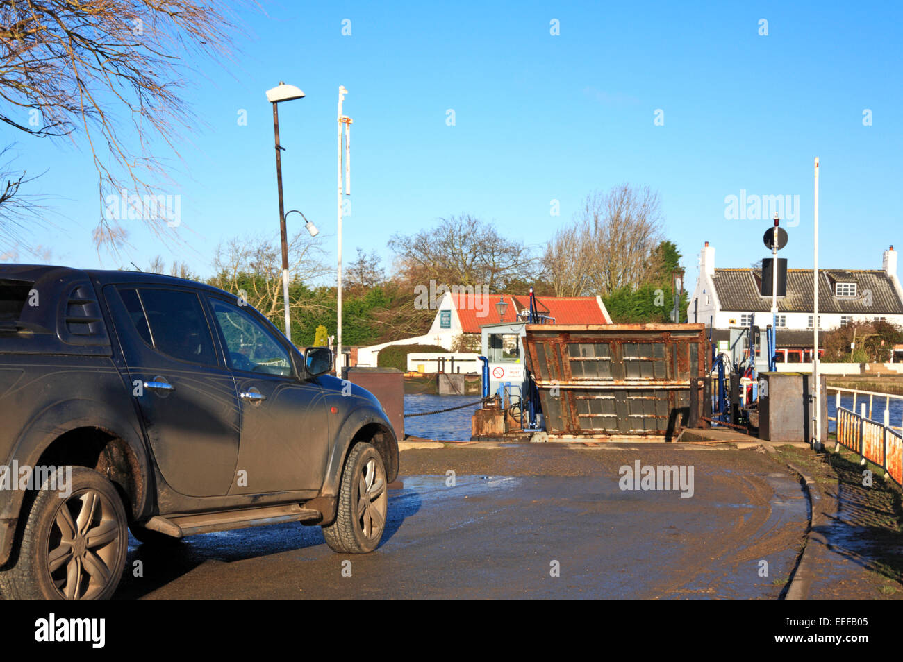 A view of a vehicle waiting to board Reedham Ferry on the River Yare on ...