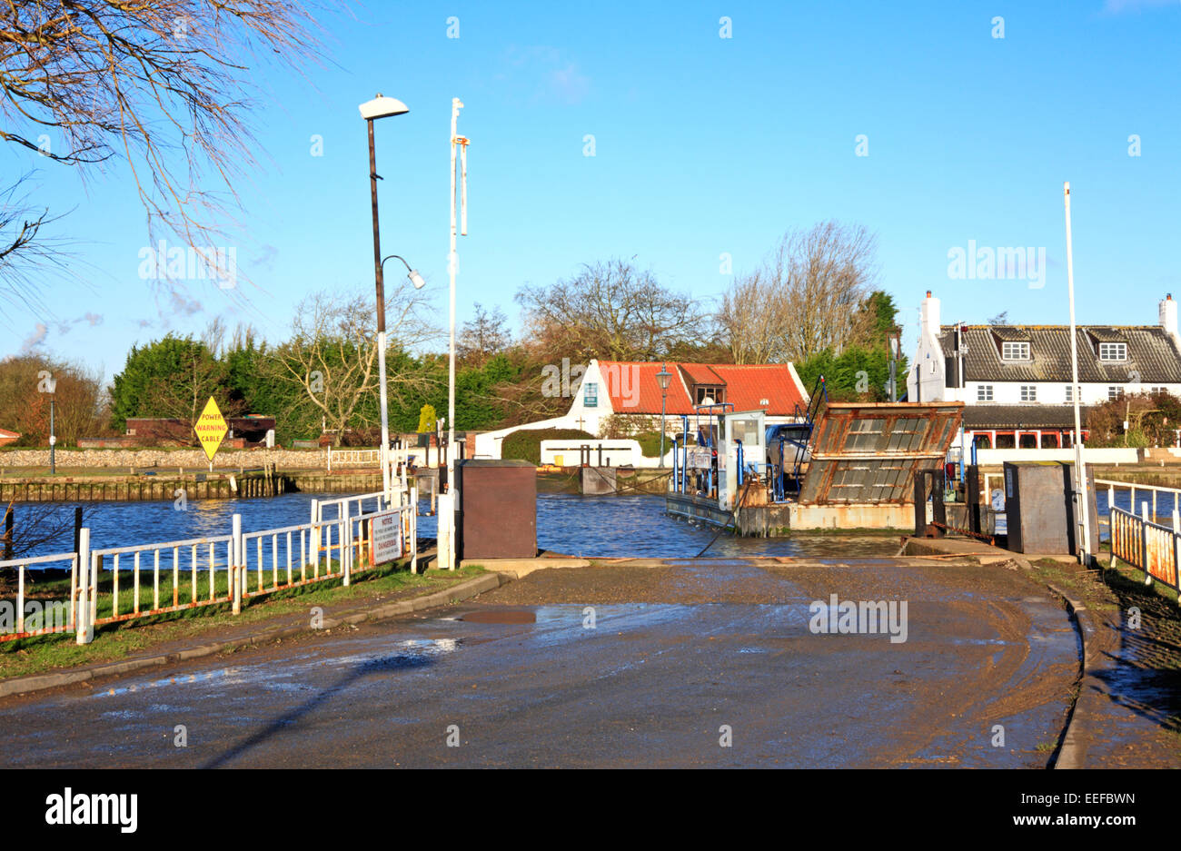 A view of a vehicle aboard Reedham Ferry and crossing the River Yare on ...