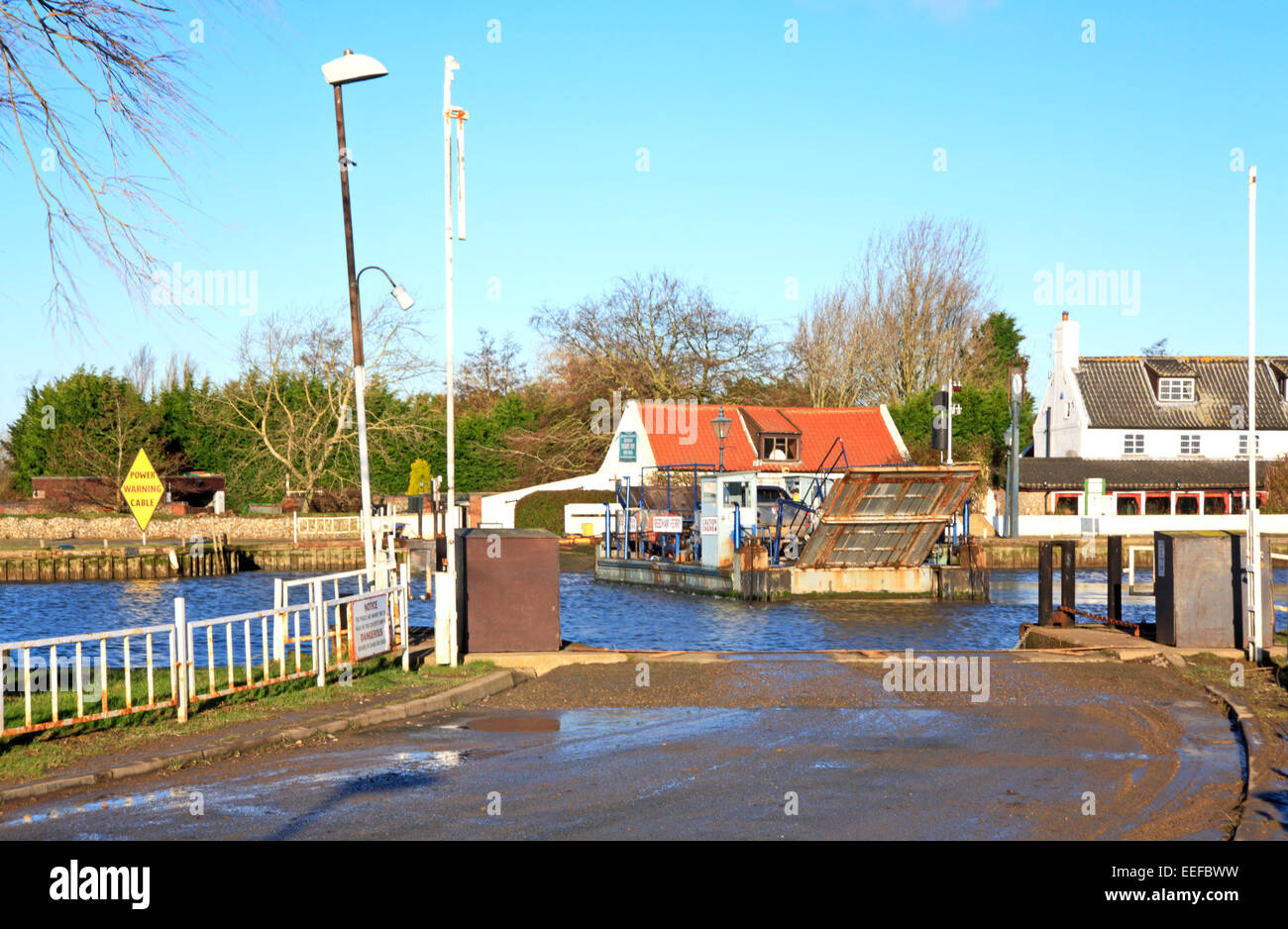 A view of Reedham Ferry with vehicle aboard completing a crossing over ...