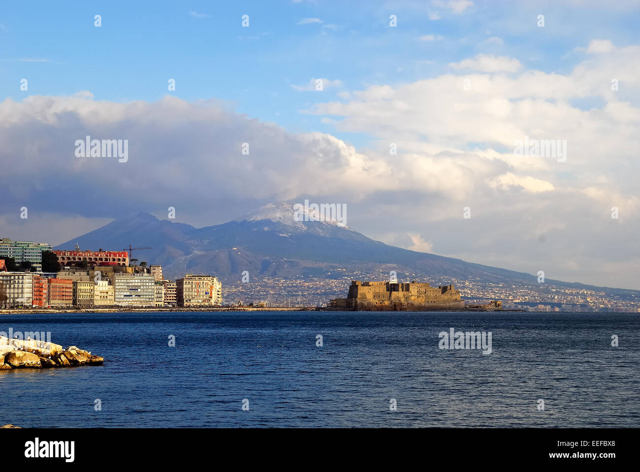 Naples, Italy. Gulf of Naples, Castel dell'Ovo and Vesuvius with snow ...