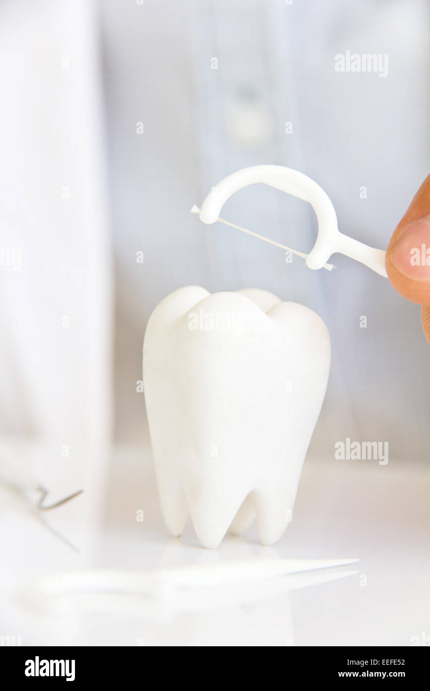 flossing teeth concept Stock Photo - Alamy