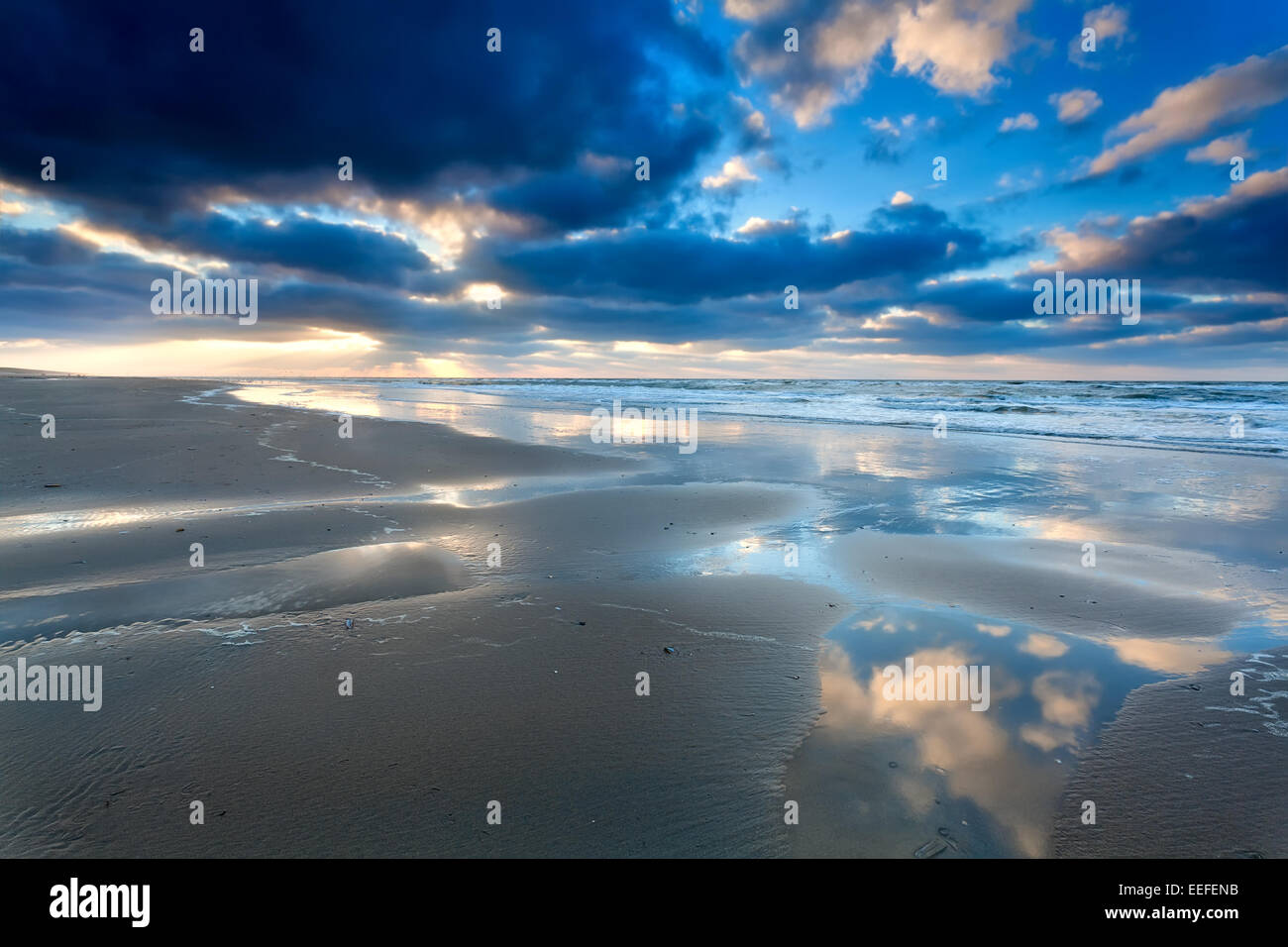 blue sky cloudscape reflected in North sea, Holland Stock Photo - Alamy