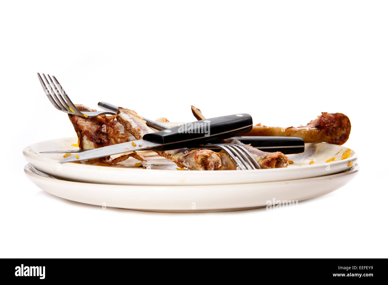 A stack of dirty plates, forks, knifes and a glass that needs washing ...